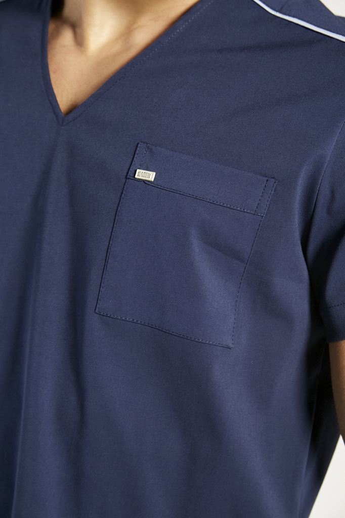 Conjunto de ambo en tela spandex combinado con vivos. color azul marin