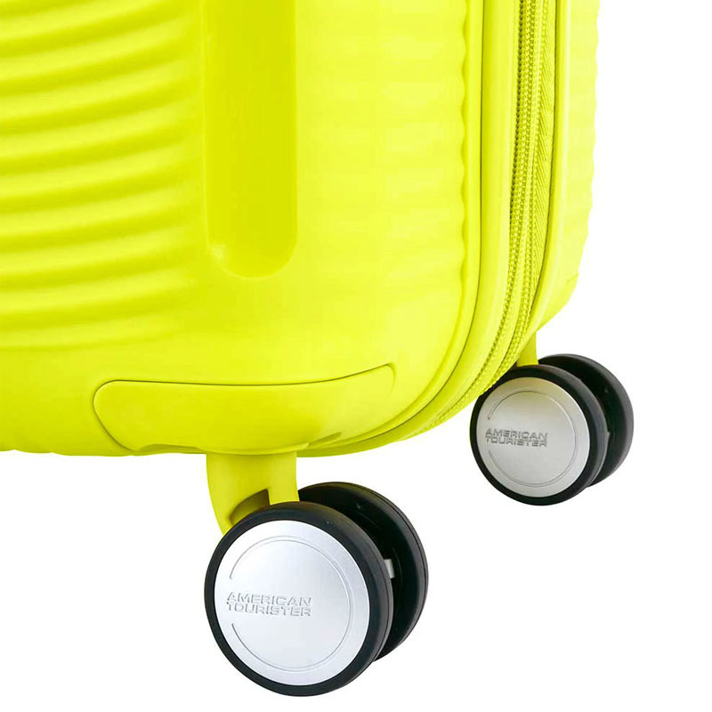 AMERICAN TOURISTER CURIO SPINNER - Grande - Amarilla